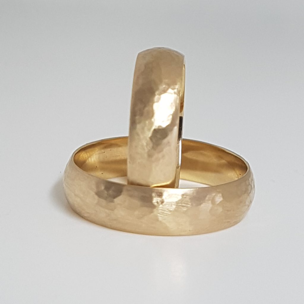 Wedding rings in 9ct hammered, yellow gold - Angela Davison - Goldsmith